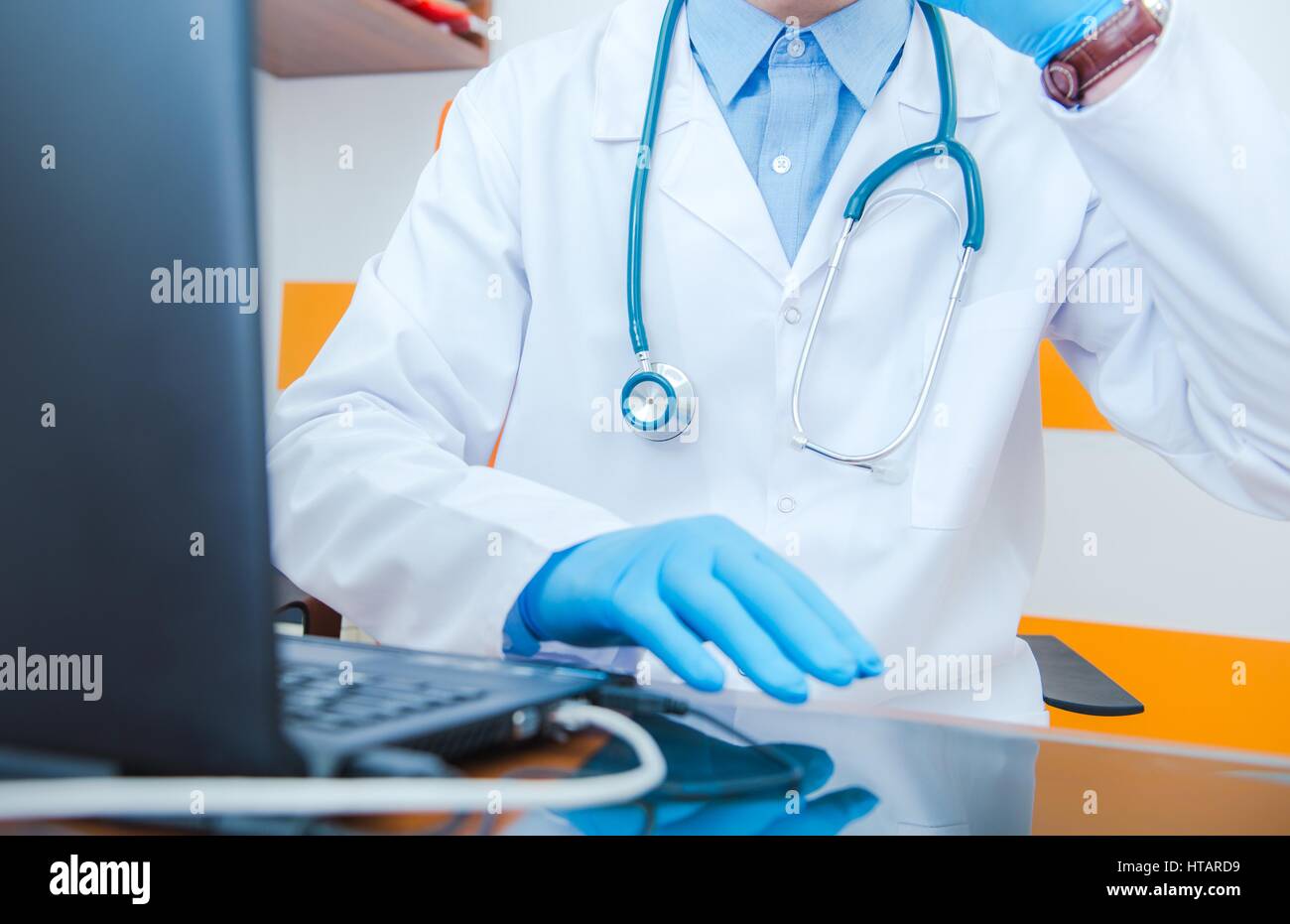 Medical Doctor and His Desk. Doctor Making Phone Call Stock Photo - Alamy