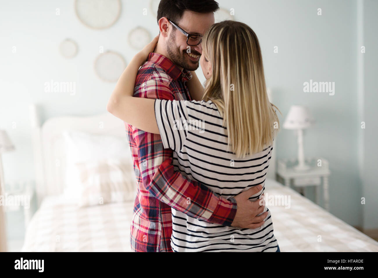 Married couple in love cuddling and hugging at home Stock Photo - Alamy