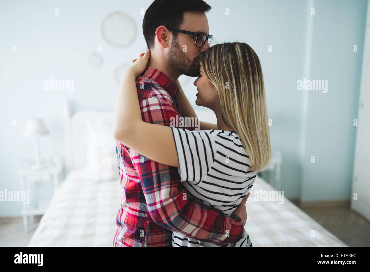 Romantic young couple hugging kissing hi-res stock photography and ...