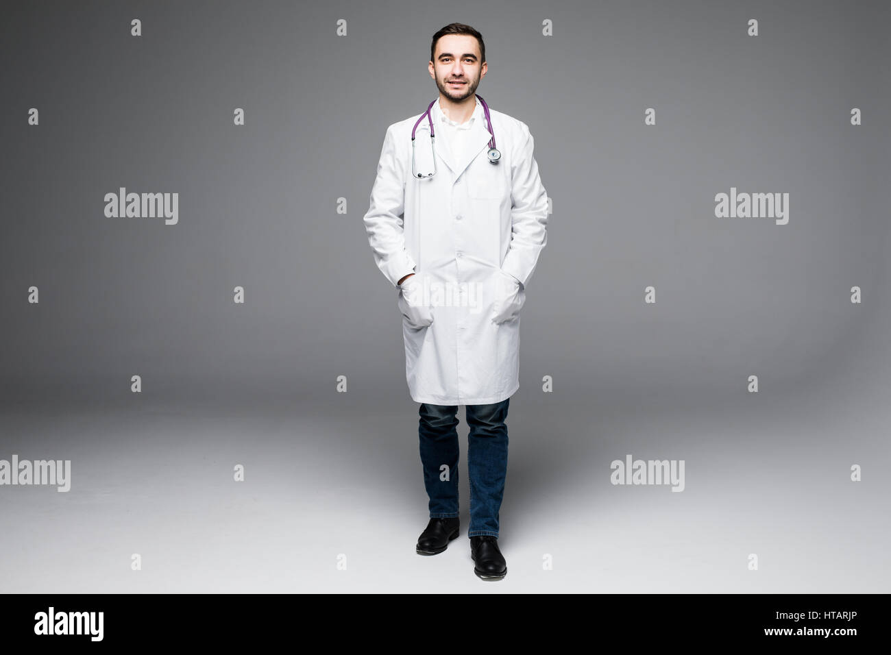 Full length young medical doctor on white background Stock Photo - Alamy