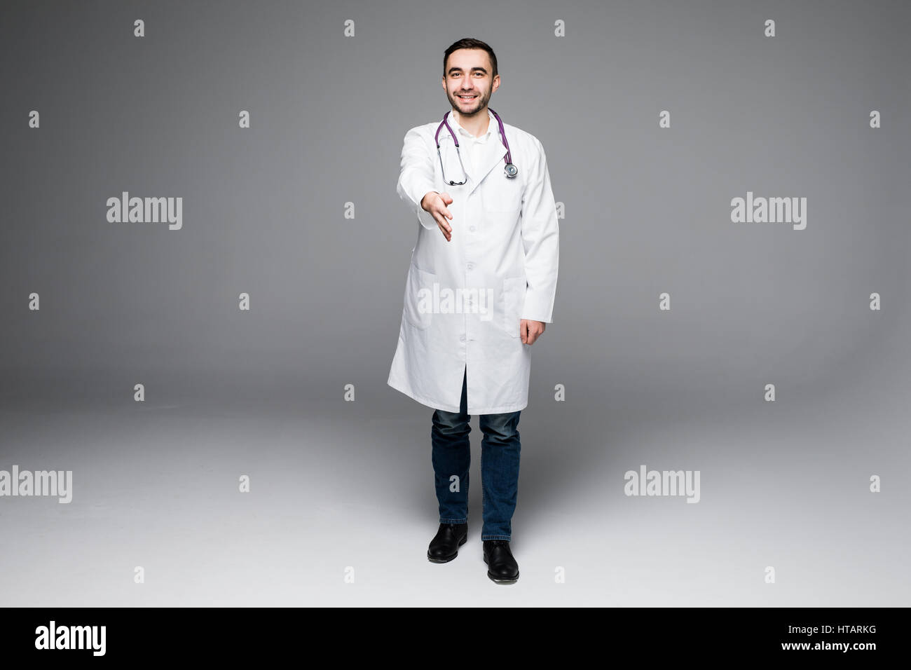 Full length young medical doctor on white background Stock Photo - Alamy
