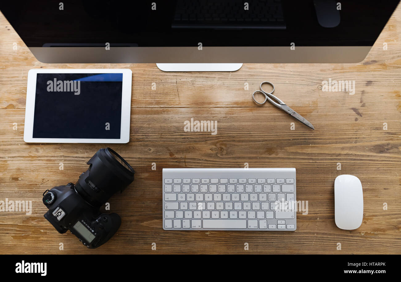 Retro wooden desk, photographers and designers work place Stock Photo ...