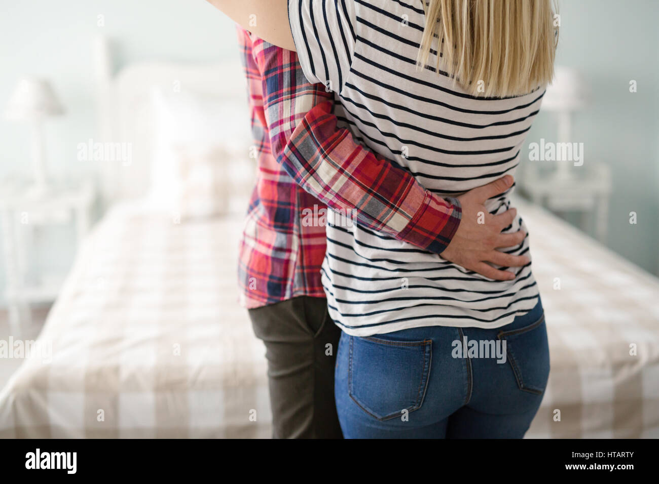 Married couple in love cuddling and hugging at home Stock Photo - Alamy