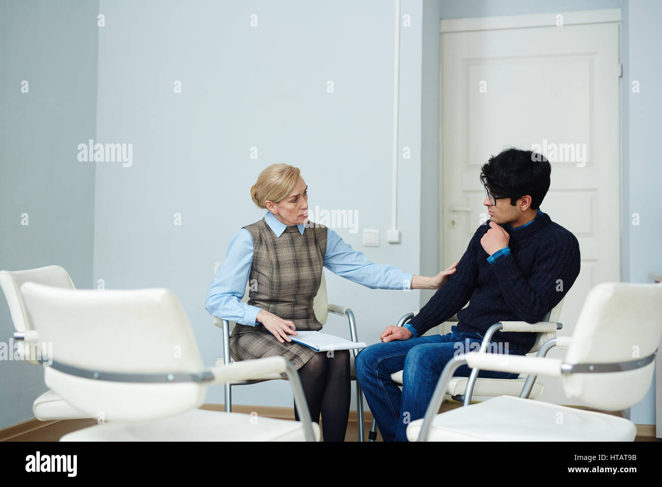 Experienced psychologist expressing her empathy to patient Stock Photo ...