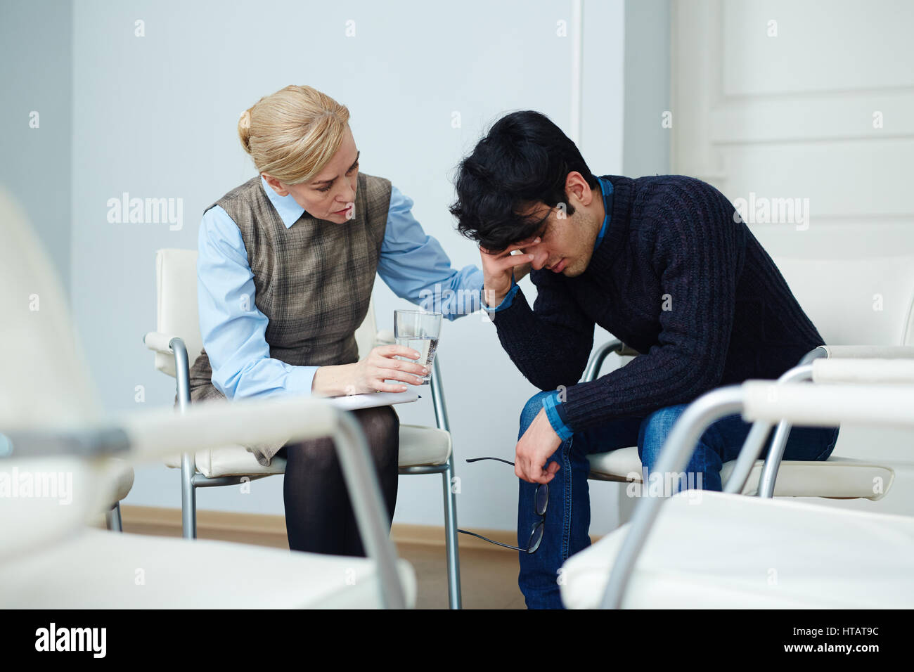 Frustrated man listening psychologist hi-res stock photography and ...
