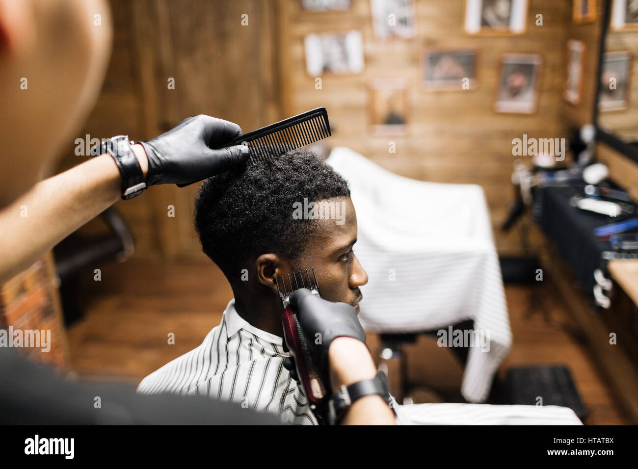 Modern guy having his hair cut in barbershop Stock Photo - Alamy