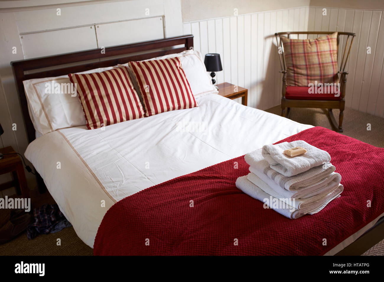 A clean set of towels on a fresh bed ready for the next guest Stock ...