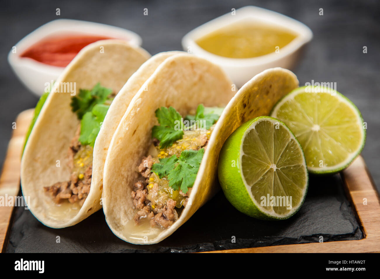 Mexican tacos with beef and green salsa Stock Photo - Alamy