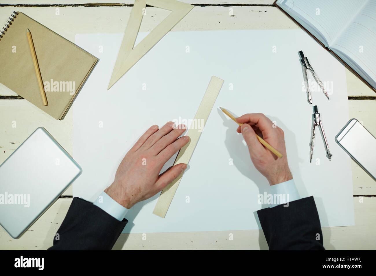 Engineer making sketch of new construction Stock Photo - Alamy