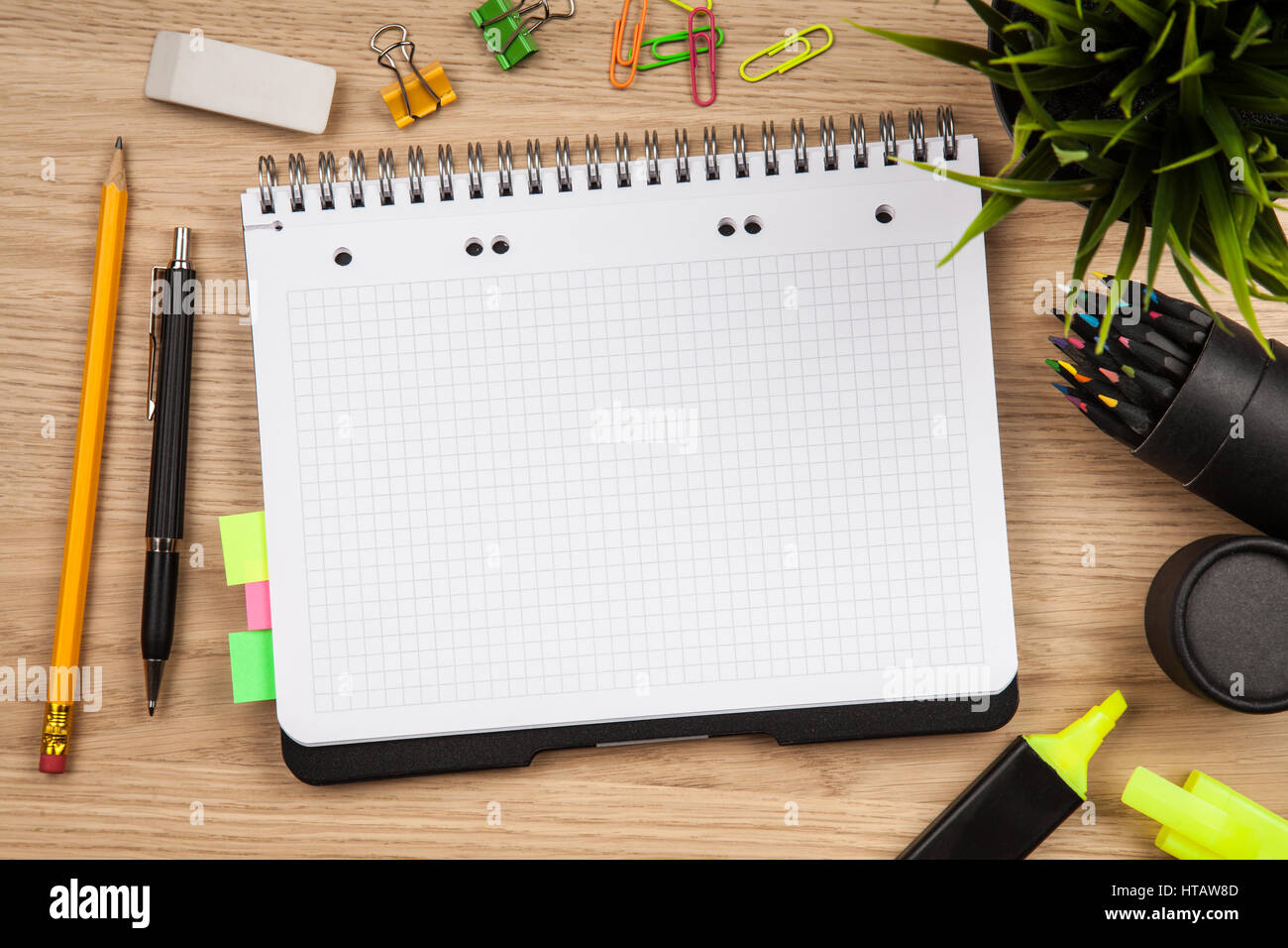 Open notepad on office table Stock Photo - Alamy