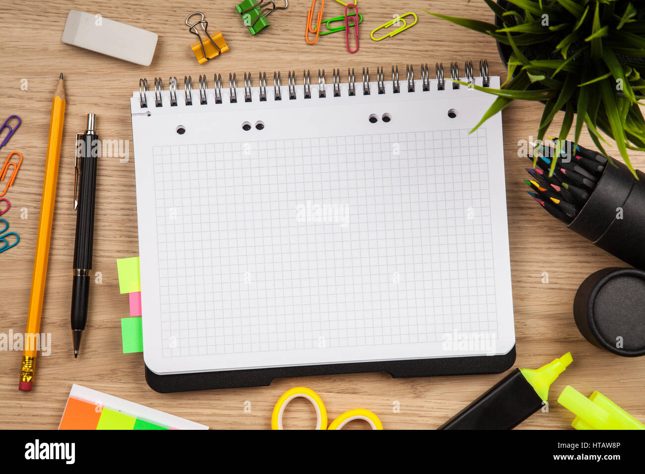 Open notepad on office table Stock Photo - Alamy