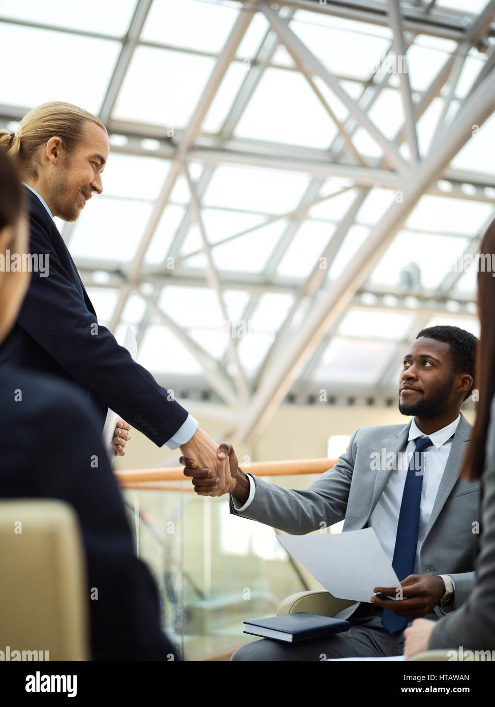 Business leader welcoming new manager Stock Photo - Alamy