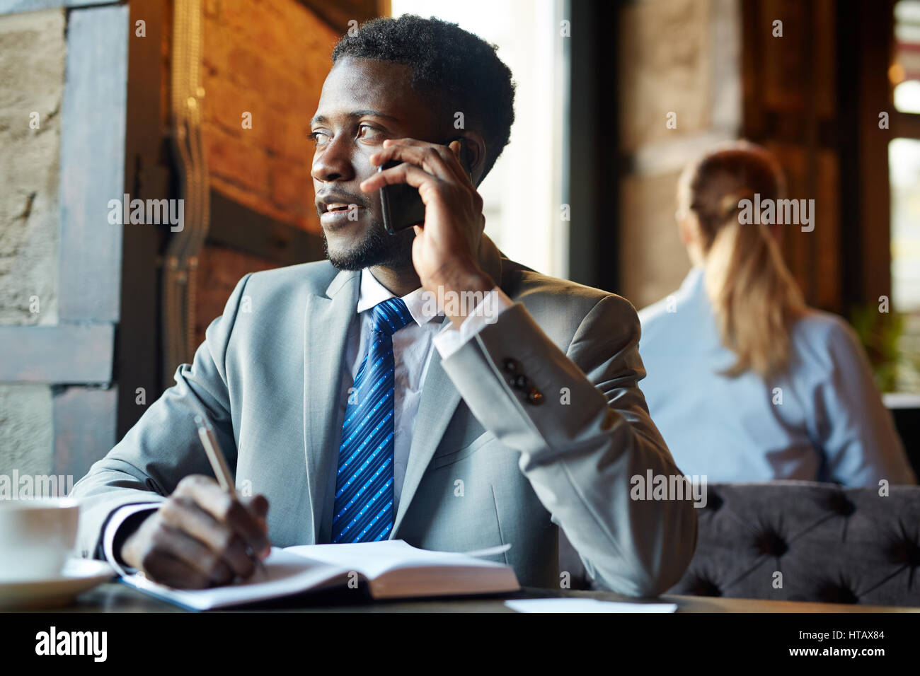 Busy talking hi-res stock photography and images - Alamy