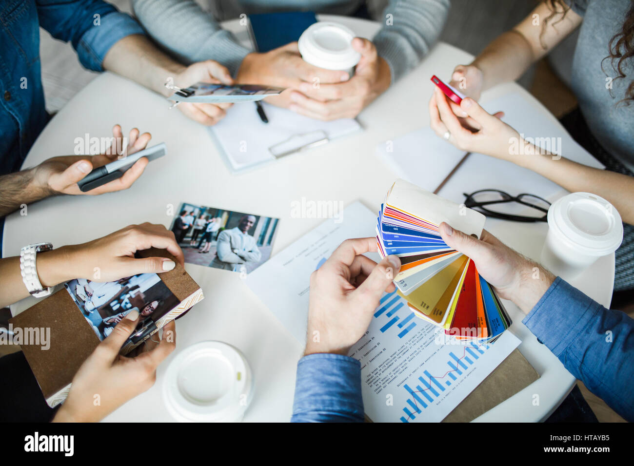 Creative people discussing colors of pallette and images Stock Photo ...