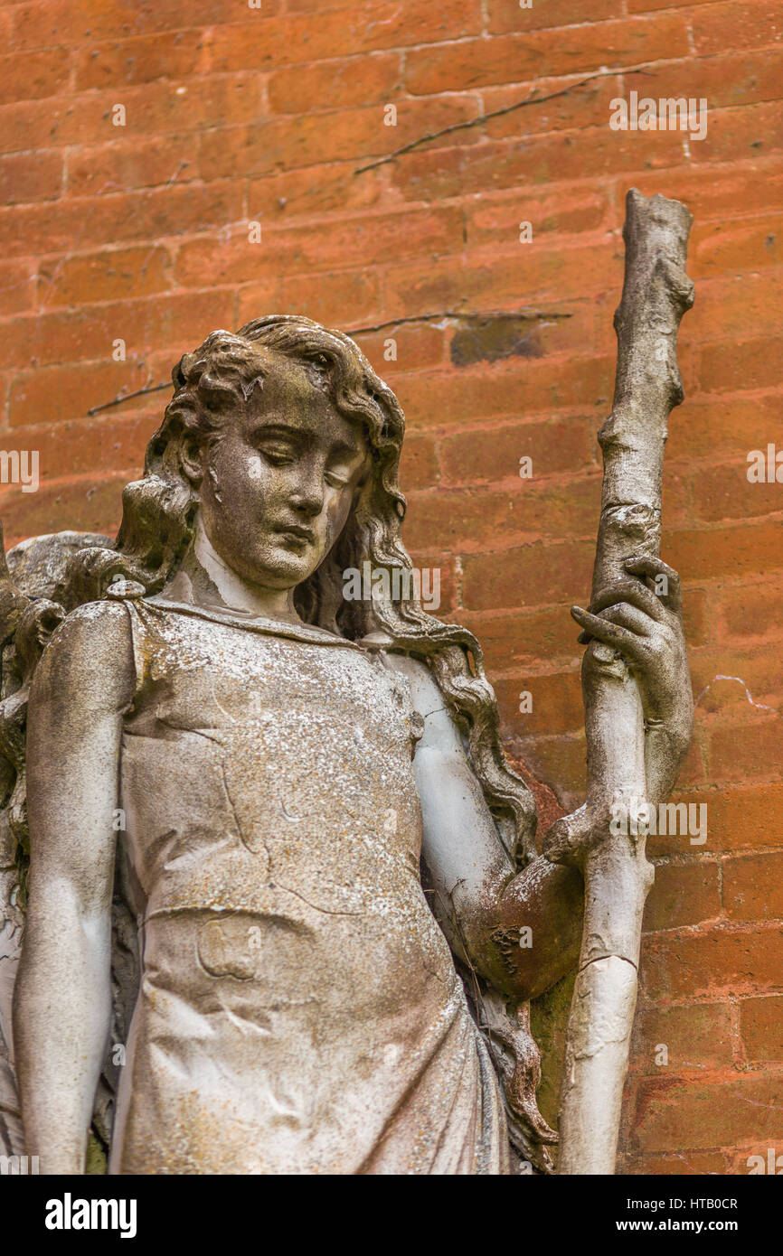 Statue angel holding stick hi-res stock photography and images - Alamy