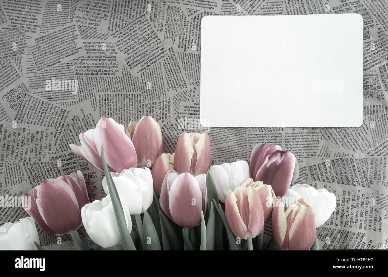 Tulips flowers bunch on Vintage newspaper background. Empty space for ...
