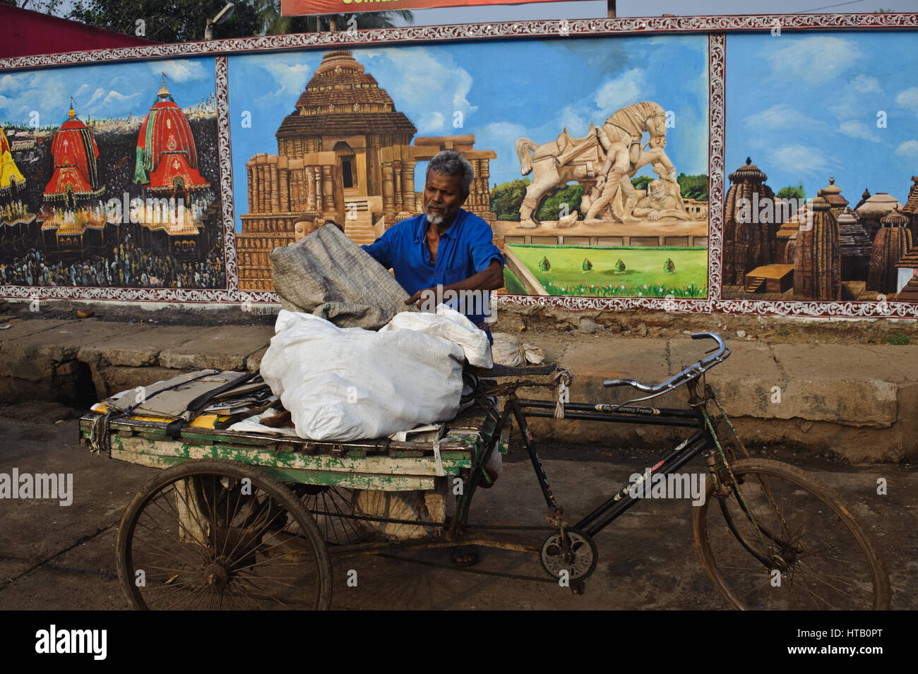 Waste recycling + mural paintings ( India) The man is recovering any ...
