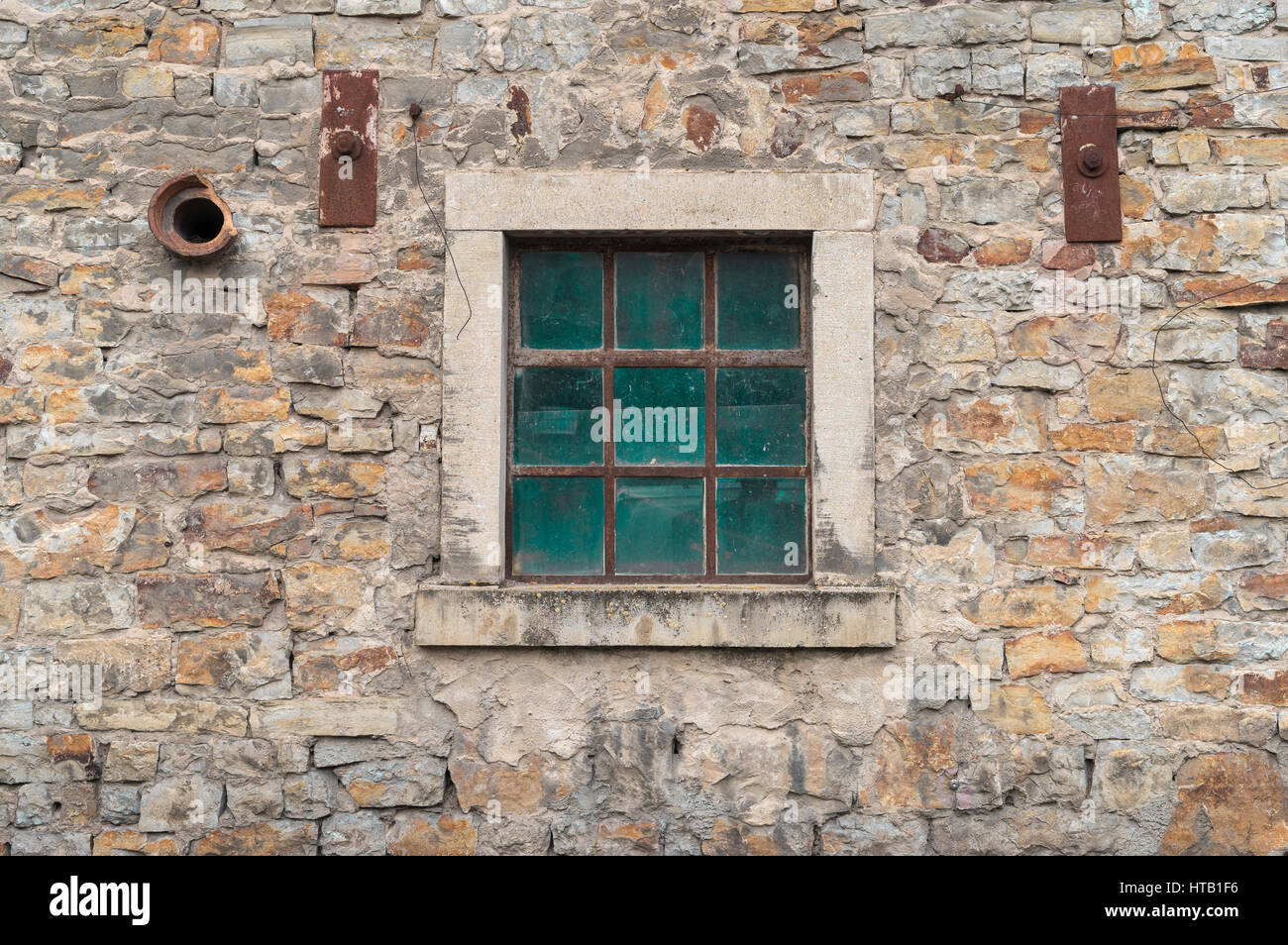 Old window on a stone wall Stock Photo - Alamy