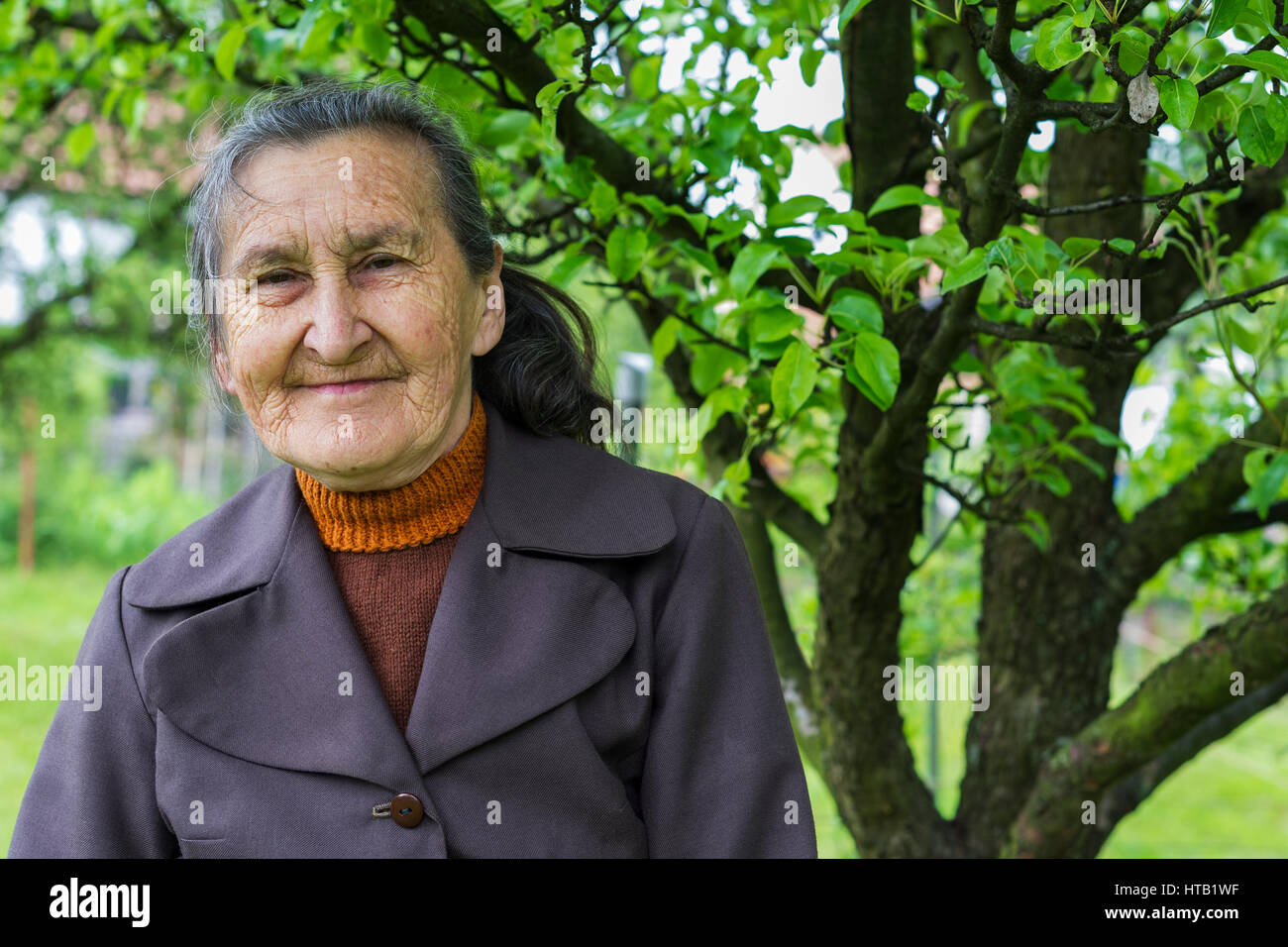 Beautiful 80 plus year old senior woman posing for a portrait in her ...
