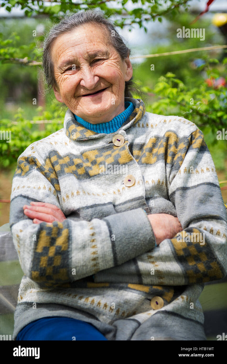 Beautiful 80 plus year old senior woman posing for a portrait in her ...
