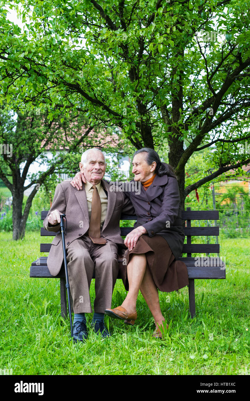 Cute 80 Plus Year Old Married Couple Posing For A Portrait In Their