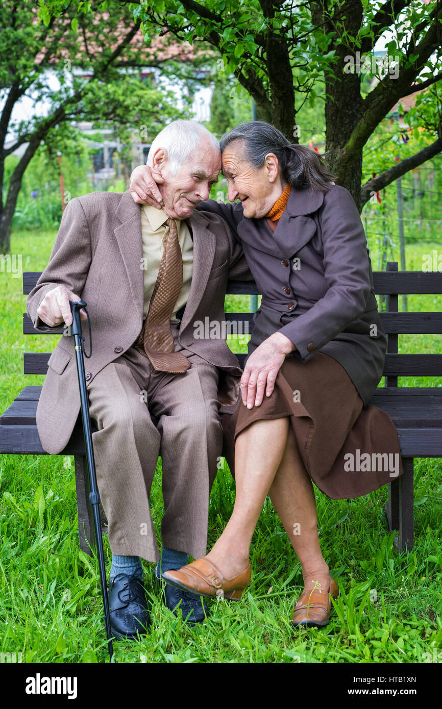 Cute 80 plus year old married couple posing for a portrait in their ...