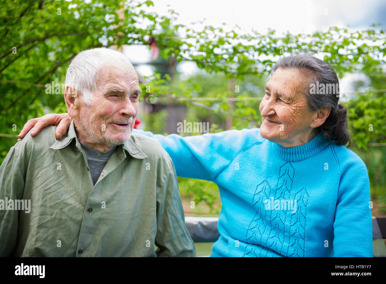 Cute 80 plus year old married couple posing for a portrait in their ...