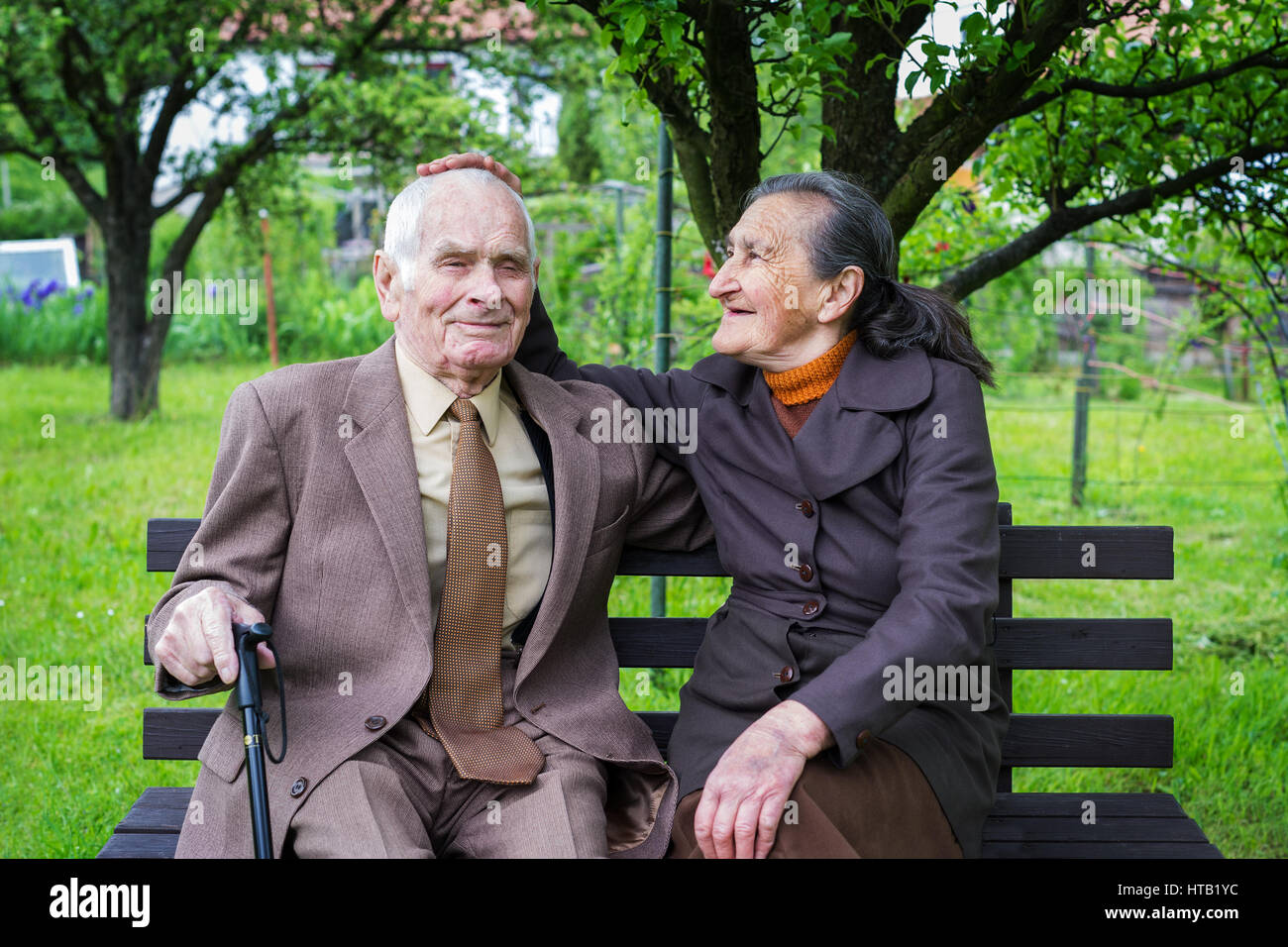 Cute 80 plus year old married couple posing for a portrait in their ...
