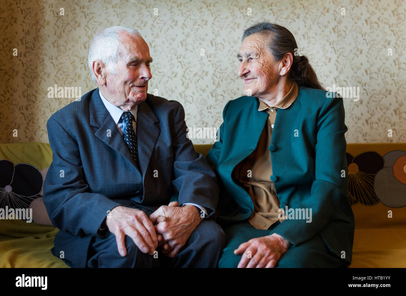 Cute 80 plus year old married couple posing for a portrait in their ...