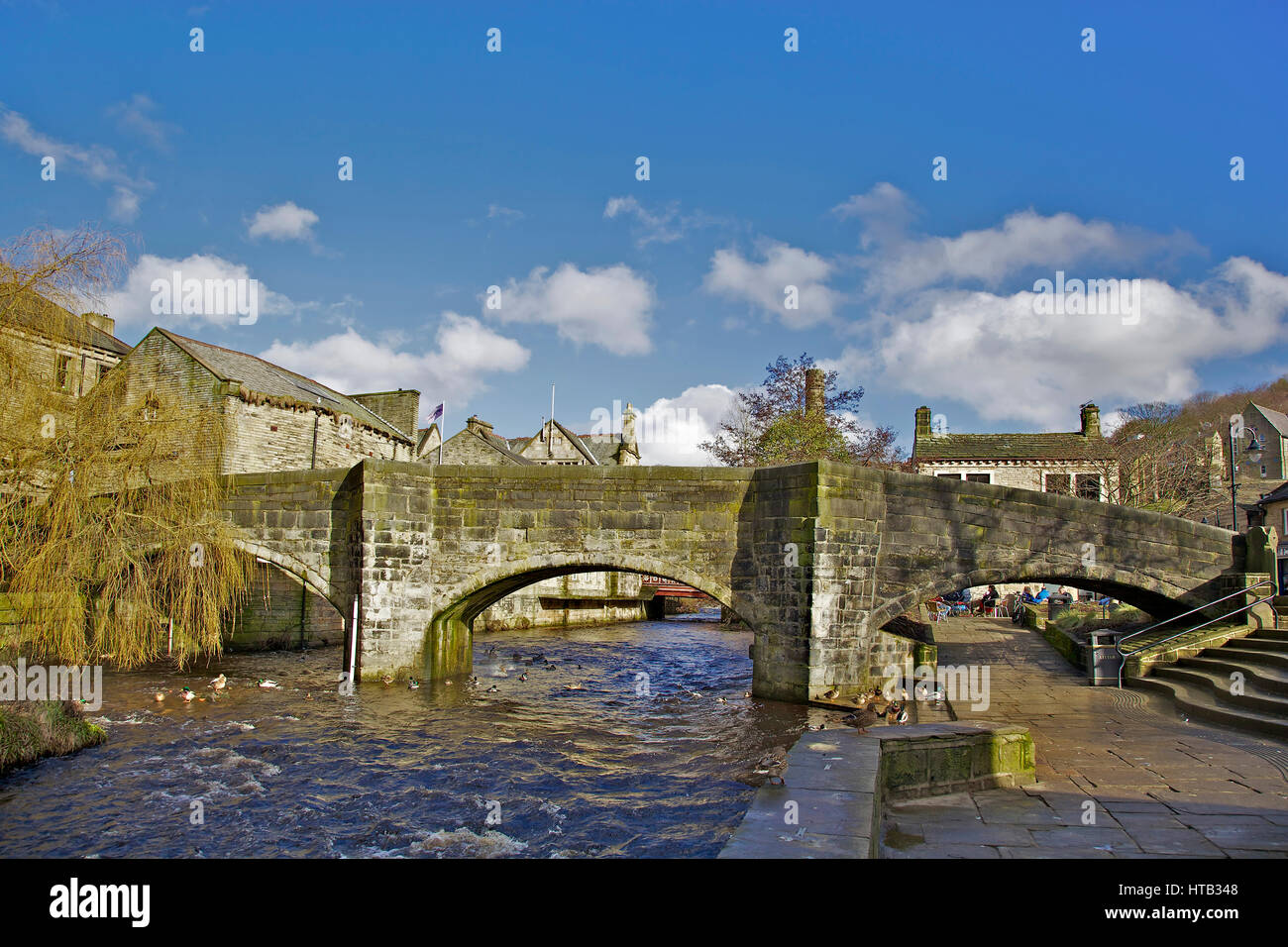 The ancient packhorse bridge over the river Wharfe in Hebden Bridge ...