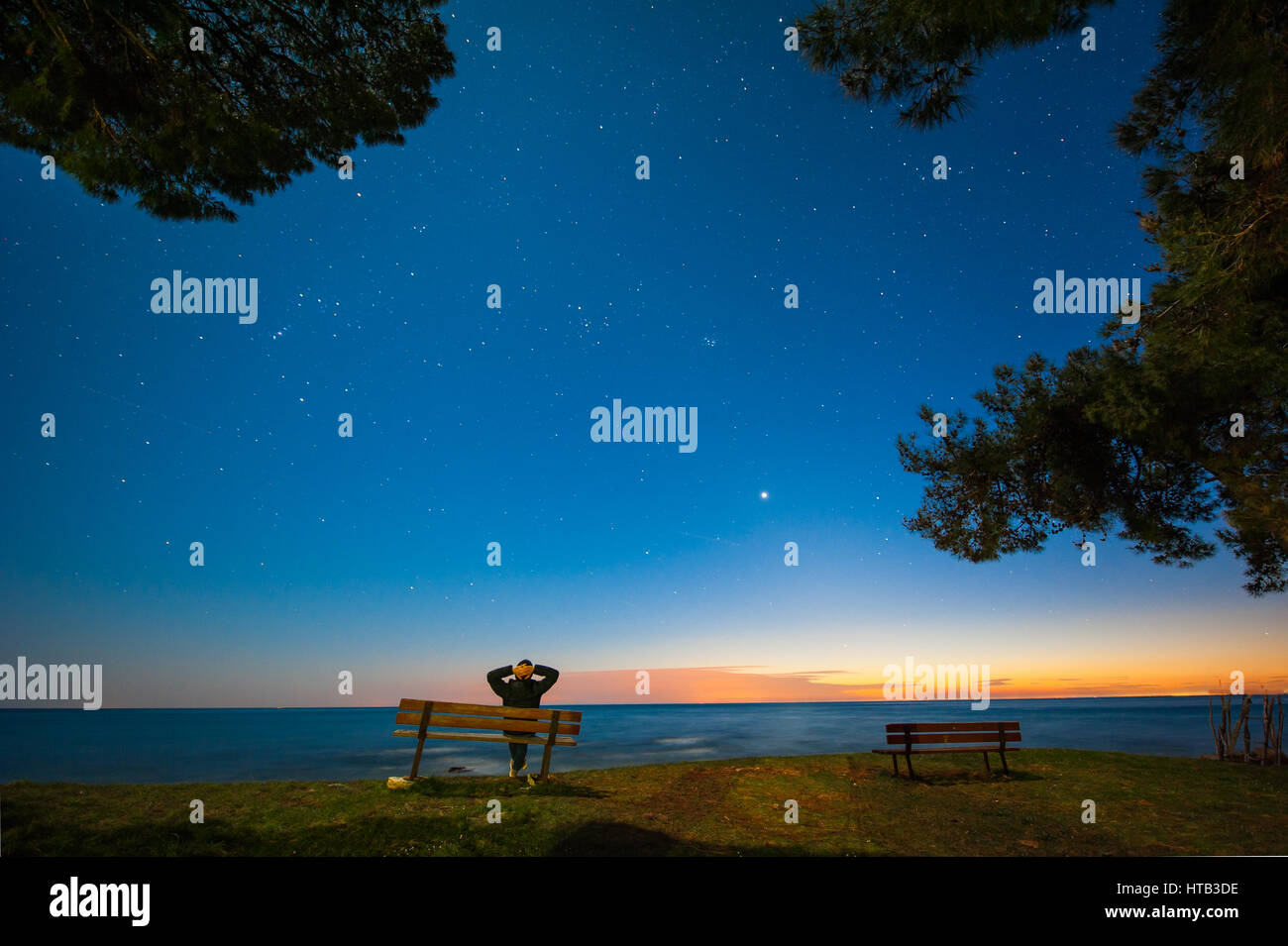 Sitting under the stars Stock Photo - Alamy