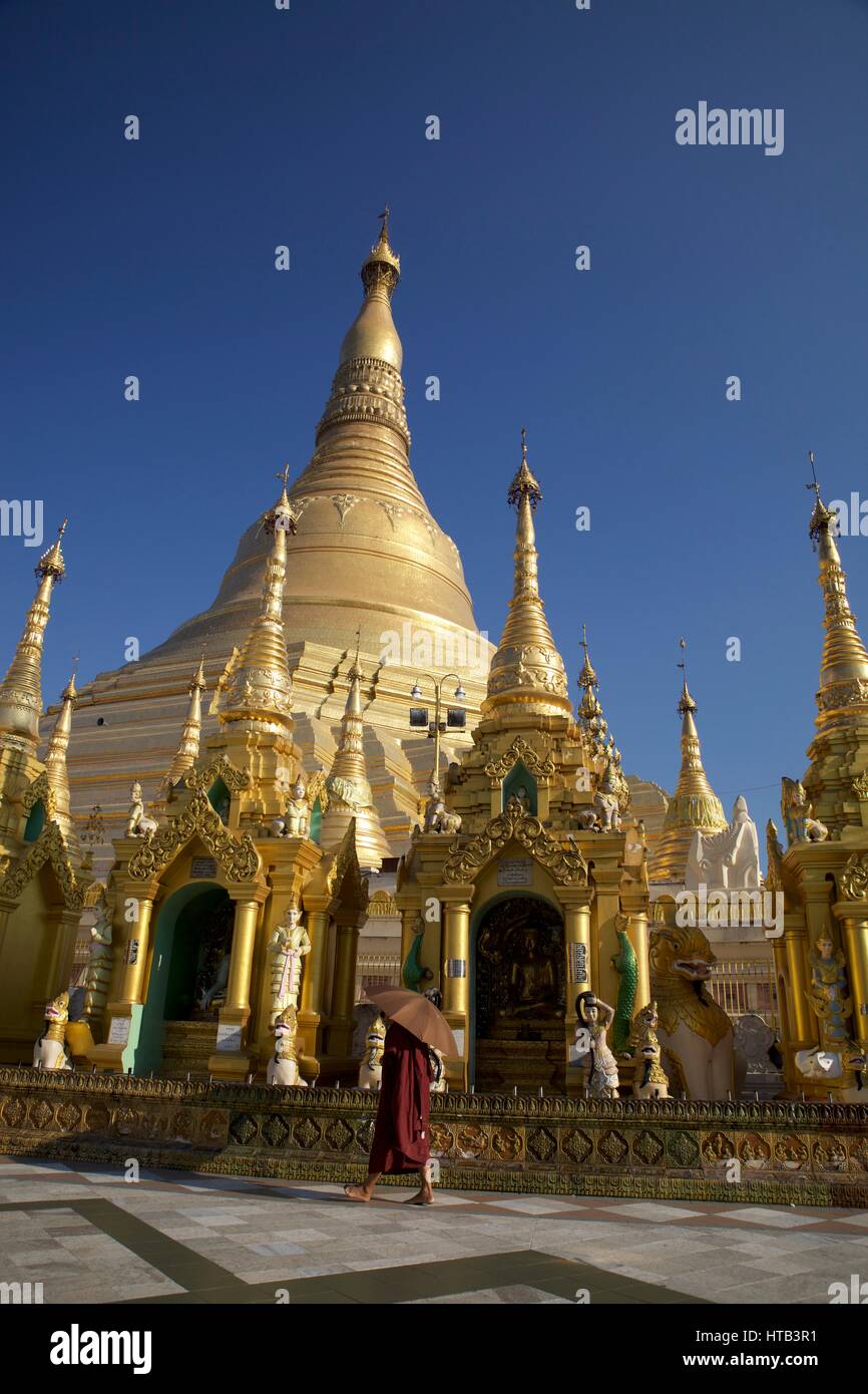 A Monk circumambulates Shwedagon Pagoda in Myanmar (Burma ...