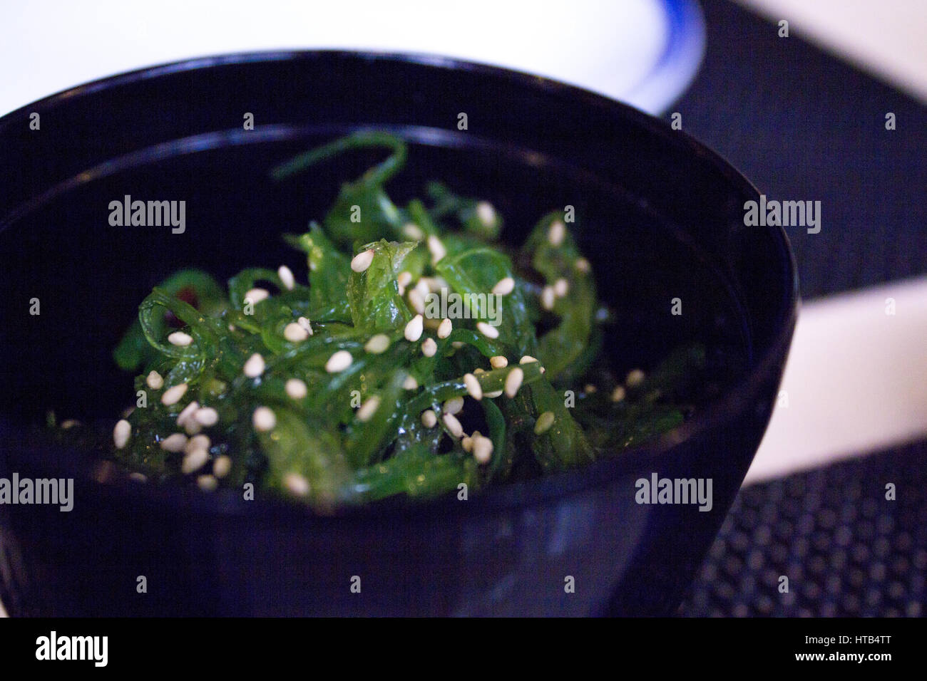 Container with wakame seaweed Stock Photo - Alamy