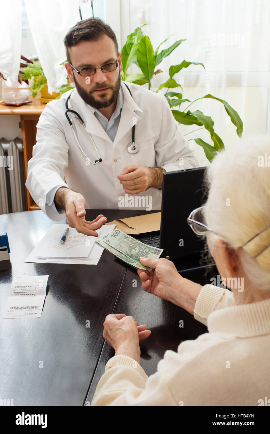 Doctor takes money hi-res stock photography and images - Alamy