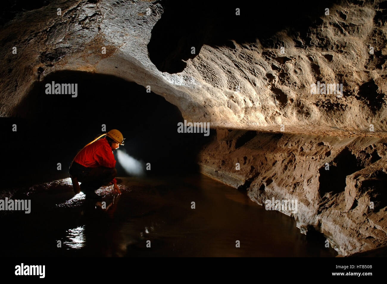 Cave explorer, spelunker exploring the underground Stock Photo - Alamy