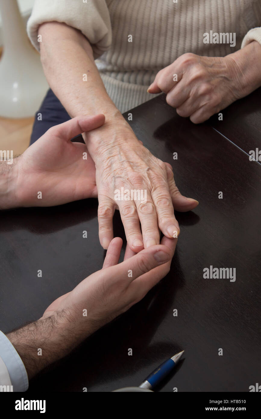 Old woman hospital hands monitor hi-res stock photography and images ...