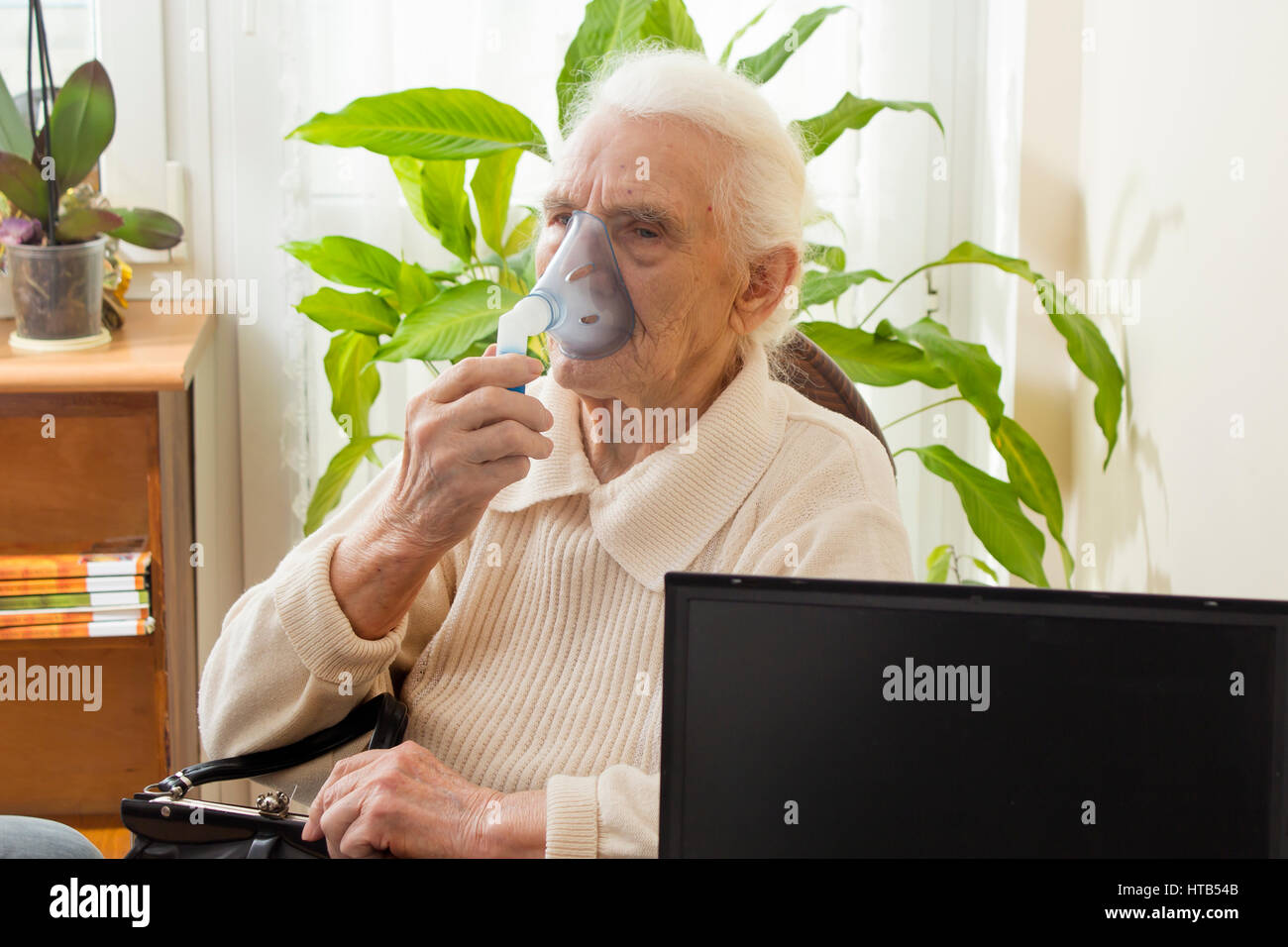 The old woman during inhaltion. The patient keeps inhaler Stock Photo ...