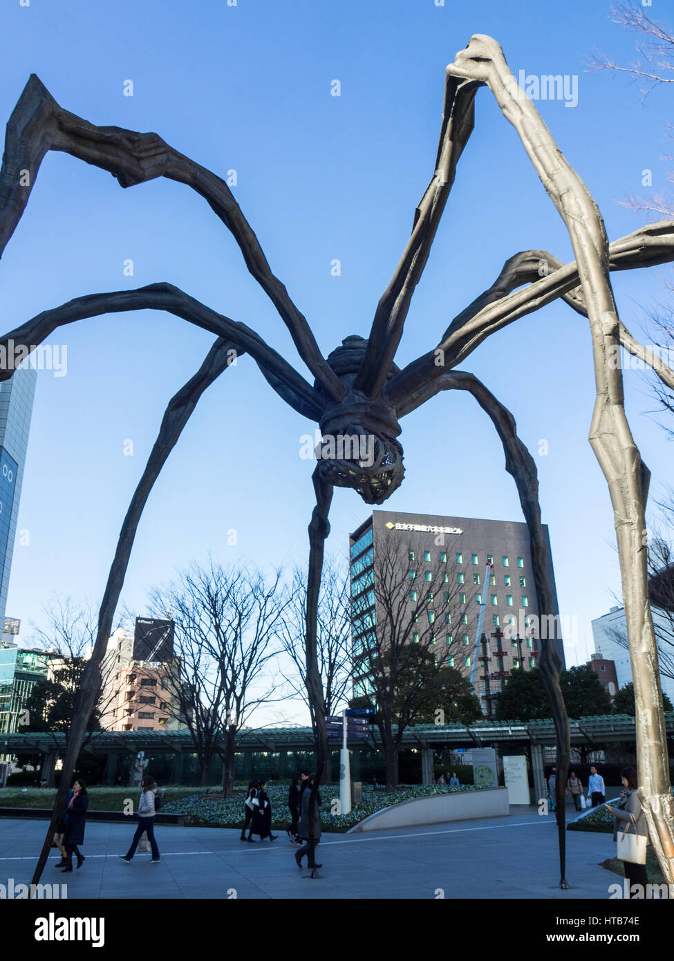 Maman, a bronze and marble sculpture of a spider by the artist Louise ...