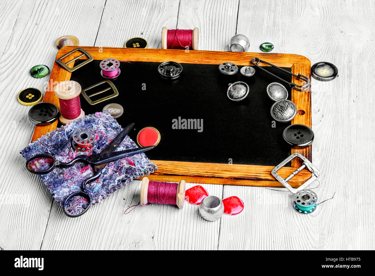 buttons and thread on the chalk board for drawing Stock Photo - Alamy