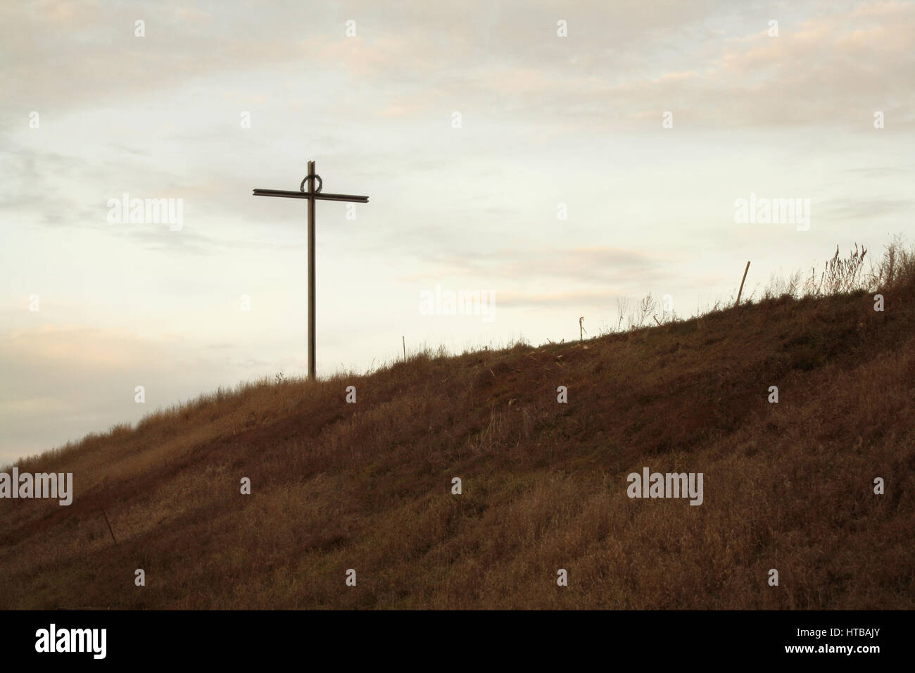 Cross on hillside Stock Photo - Alamy