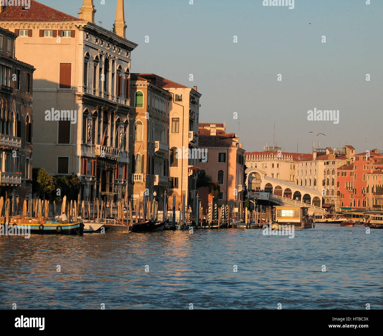 Golden hour illuminates the historic buildings along the Grand Canal in ...