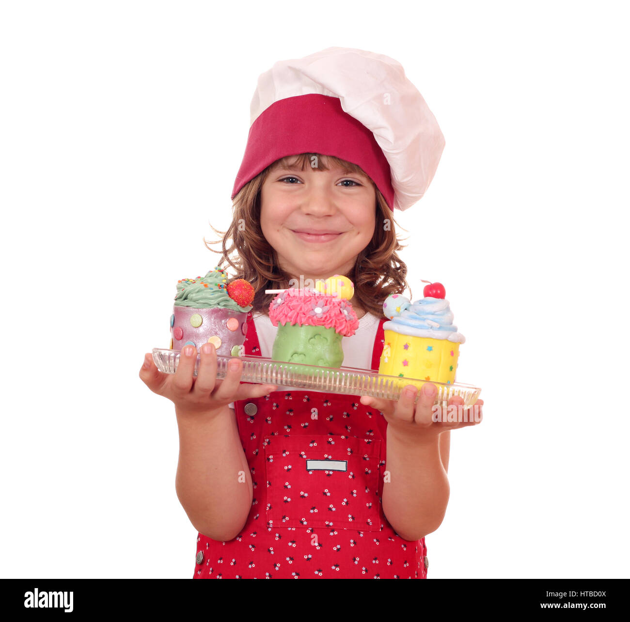 happy little girl cook with colorful sweet cupcakes Stock Photo - Alamy