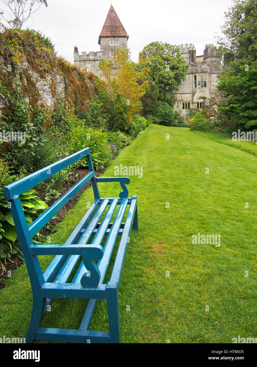 A bright blue bench in the garden of Lismore Castle in Ireland Stock ...