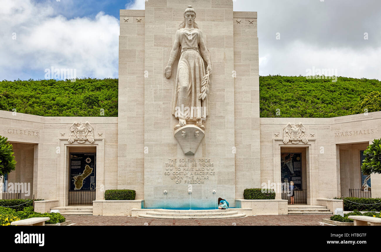 Honolulu, Hawaii, USA - August 7, 2016: An unidentified woman sits near ...