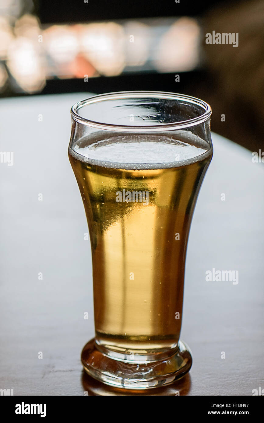 Pale golden beer on table Stock Photo - Alamy