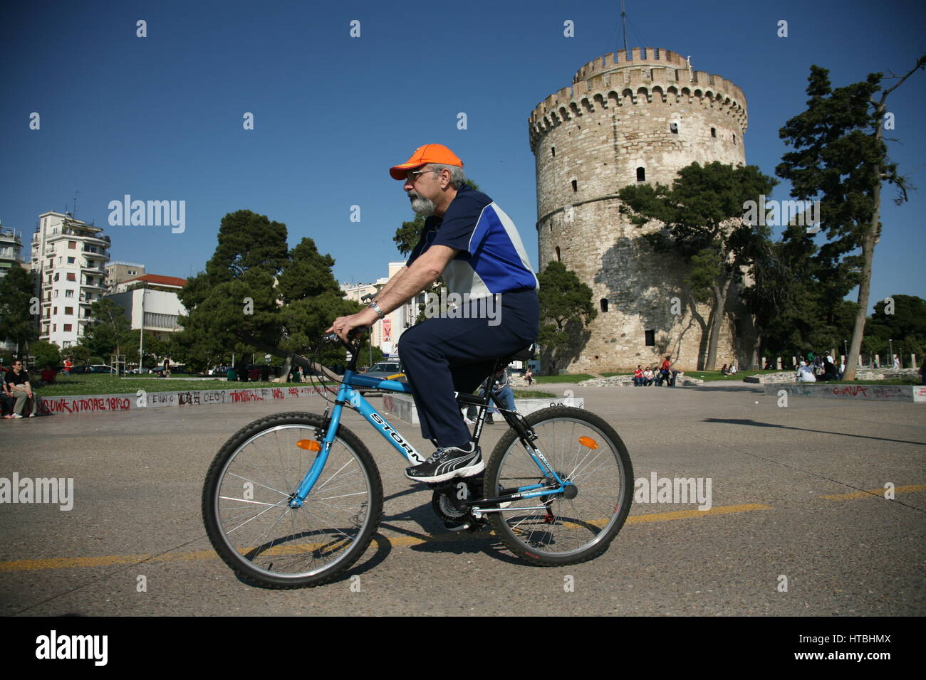 THESSALONIKI. GREECE. MAY 15, 2011 : Middle aged man riding bike on ...