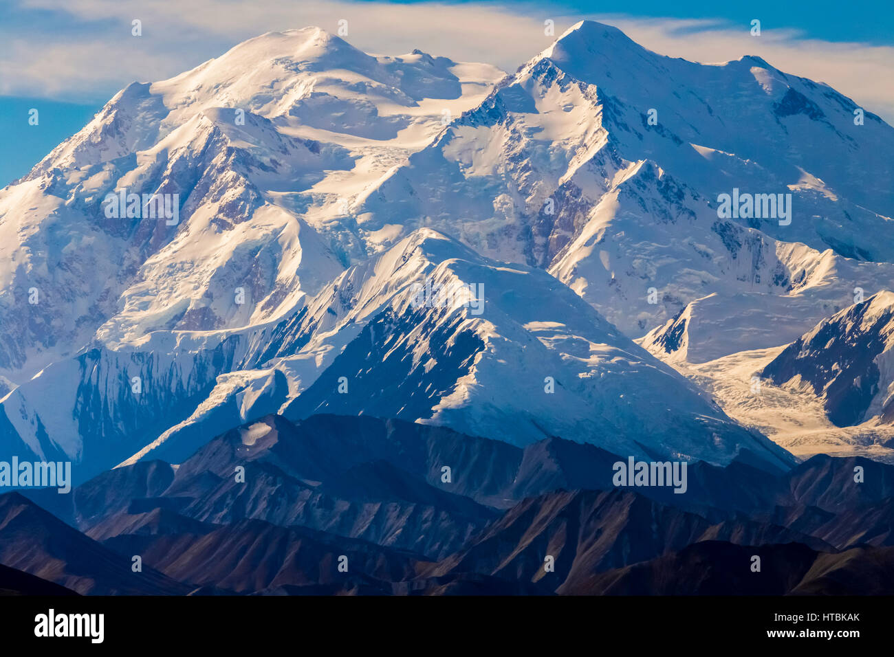Denali towers above surrounding mountain ridges in Denali National Park ...