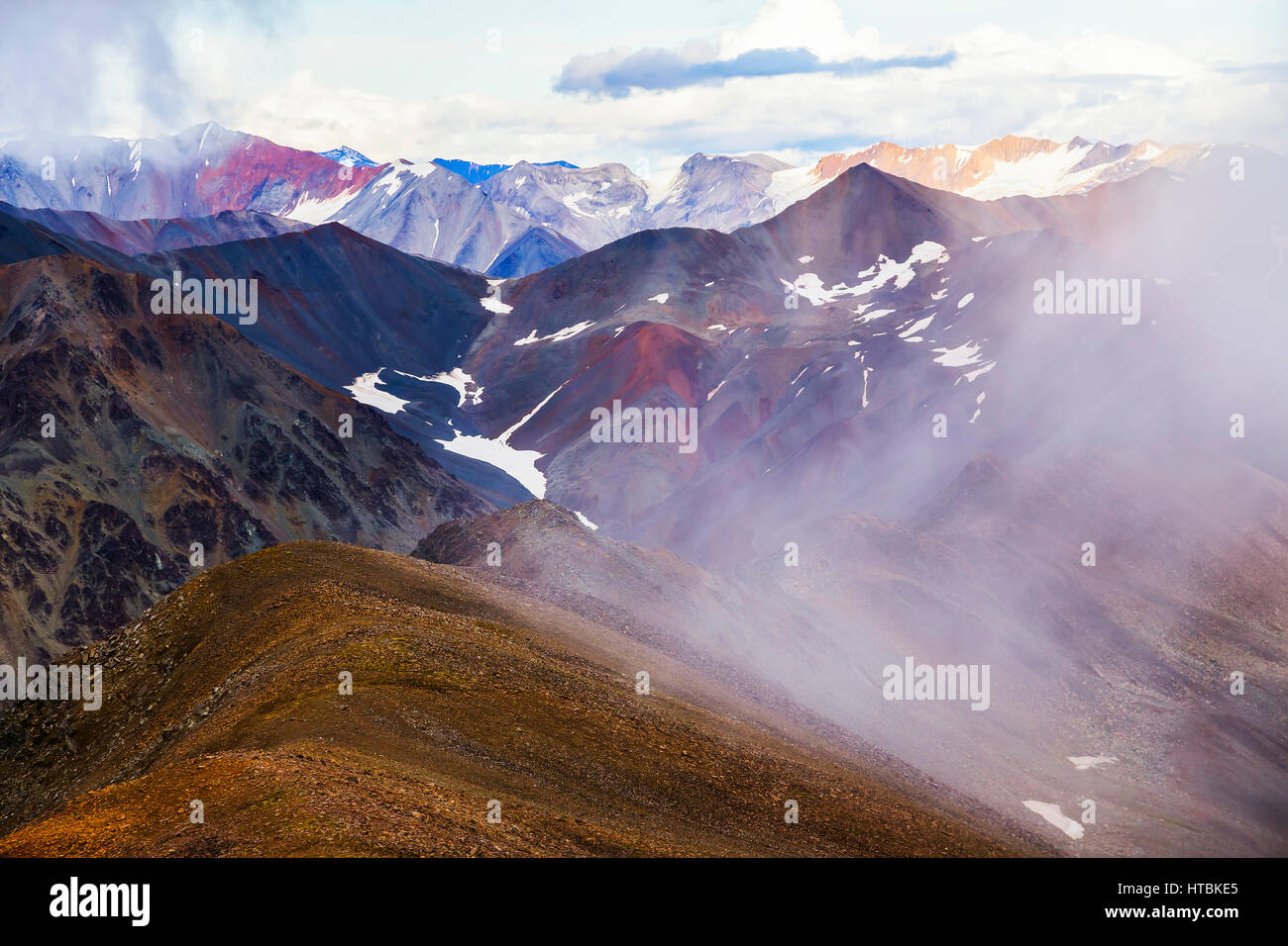 Clouds form along a ridge in the Alaska Range; Alaska, United States of ...