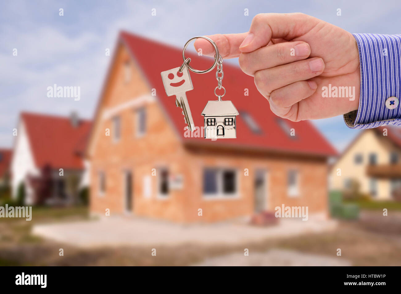 key in hand for new home and real estate Stock Photo - Alamy