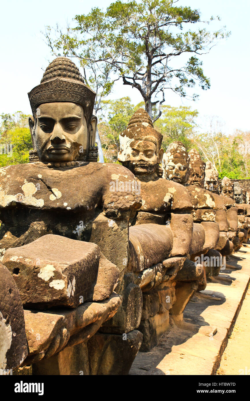 South gate to angkor thom in Cambodia is lined with warriors and demons ...